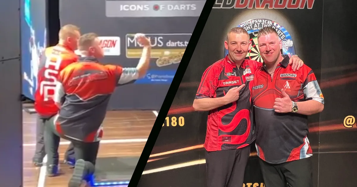 VIDEO: Daryl Gurney has to throw darts while Nathan Aspinall sits on his knee