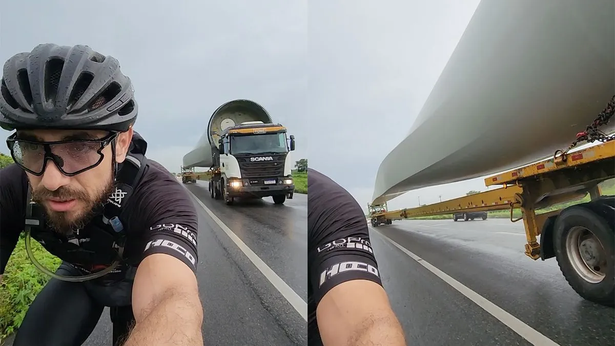 Fietser ziet een wiek van windmolen wel van heel dichtbij, wat een ...